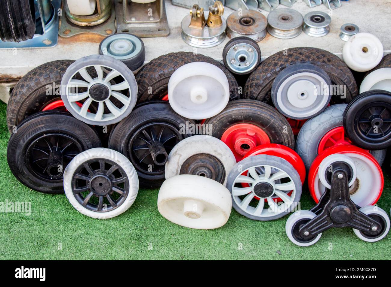 Various sized, colored and shaped wheels in the view Stock Photo - Alamy