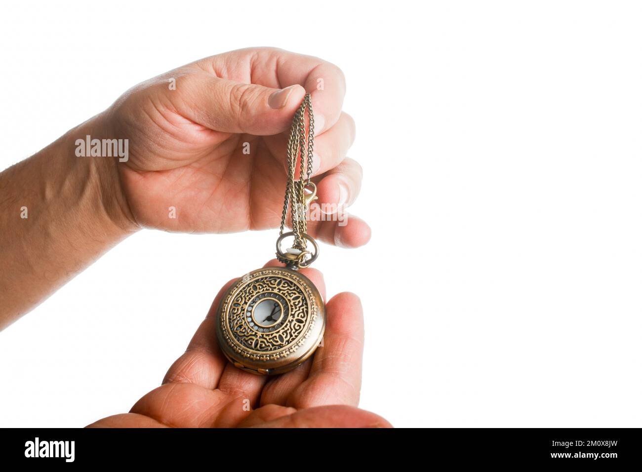Hand holding a retro styled metal pocket watch in hand on a white ...