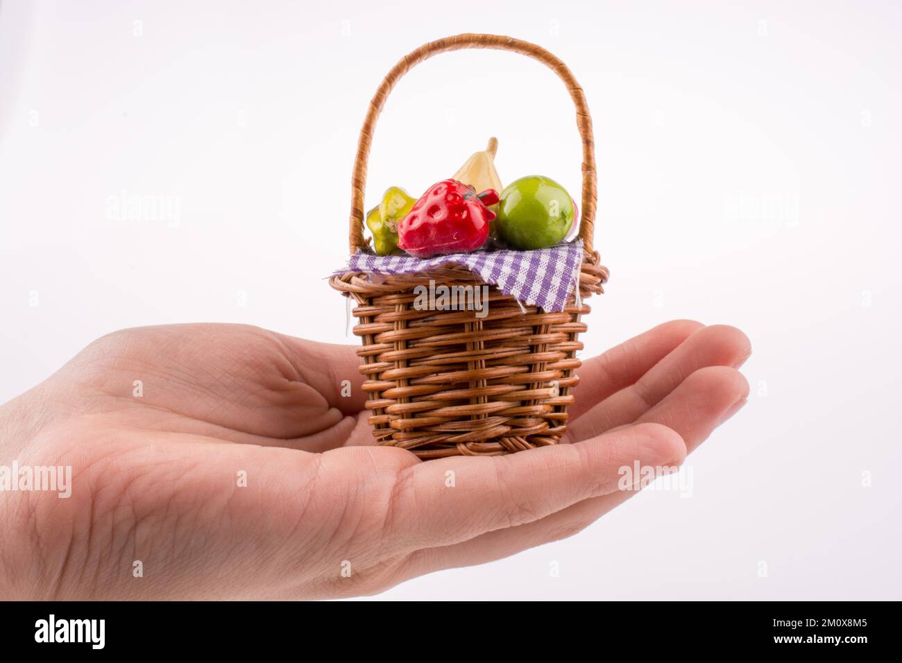 Hand holding fruit basket on hi-res stock photography and images - Alamy