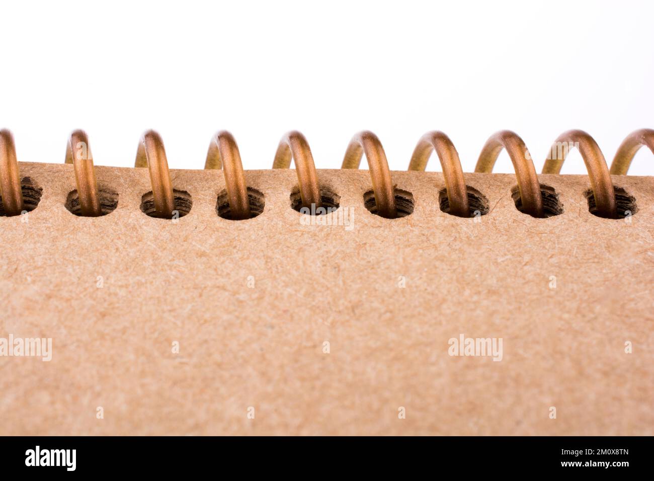 Brown spiral Notebook on a white background Stock Photo - Alamy