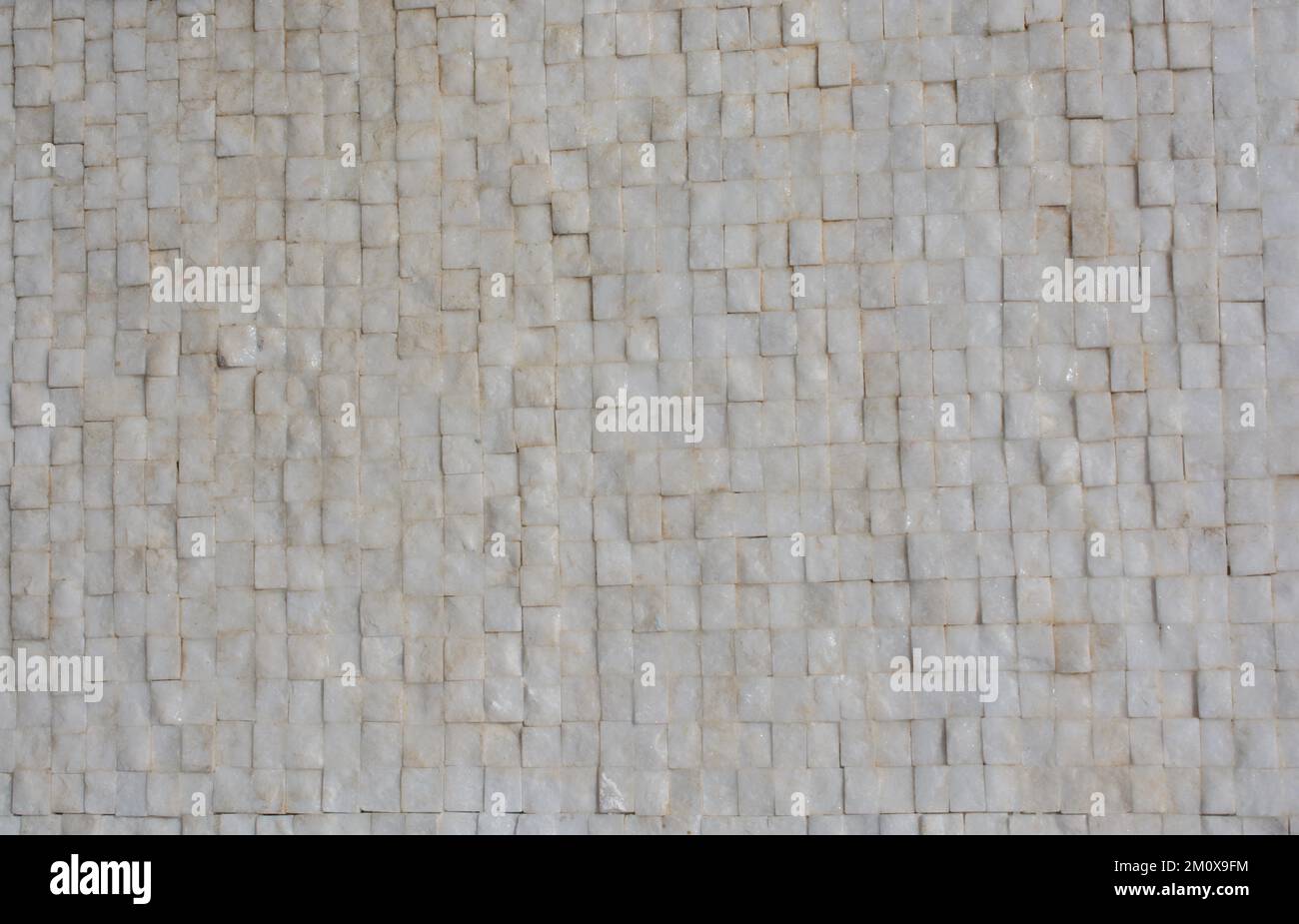 Decorative cubic stone wall as background texture Stock Photo - Alamy