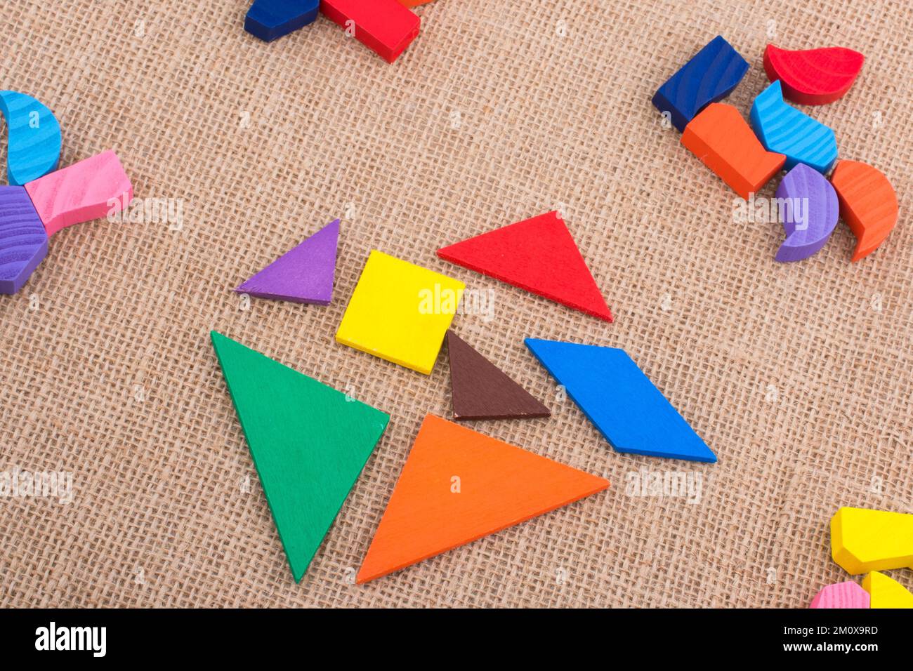 Colorful pieces of a square tangram puzzle Stock Photo - Alamy