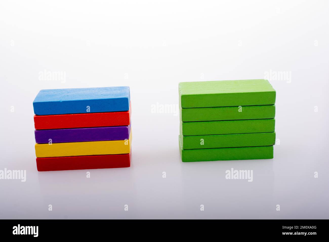 Colorful Domino Blocks in a line on a white background Stock Photo - Alamy
