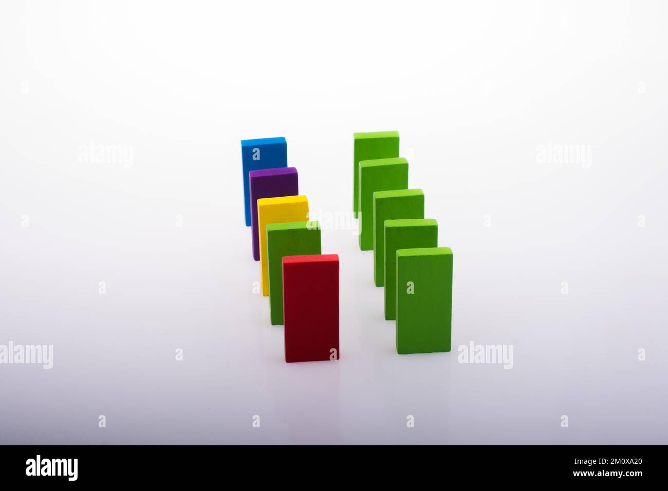 Colorful Domino Blocks in a line on a white background Stock Photo - Alamy