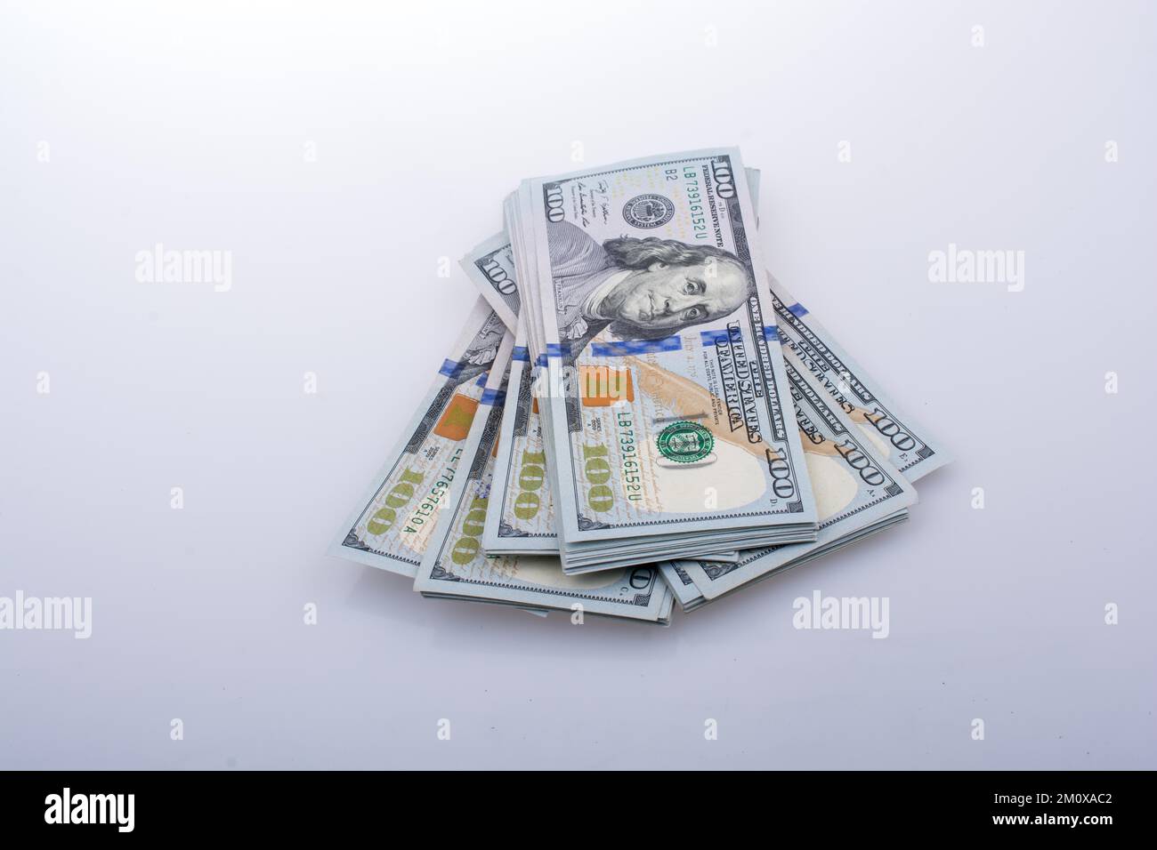 American 100 dollar banknote bundles placed on white background Stock ...