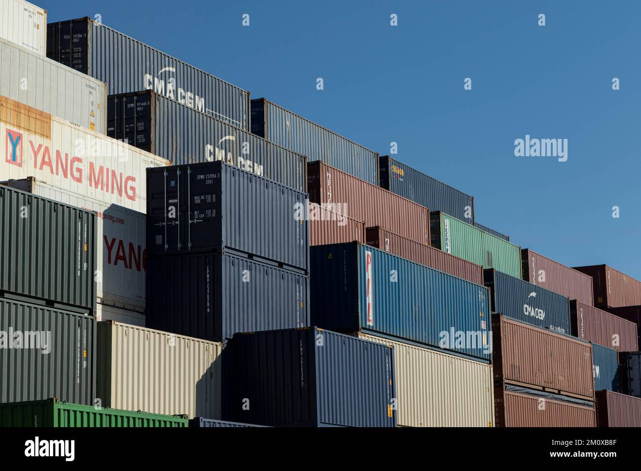Symbolic image of logistics, containers against a blue sky in the port ...