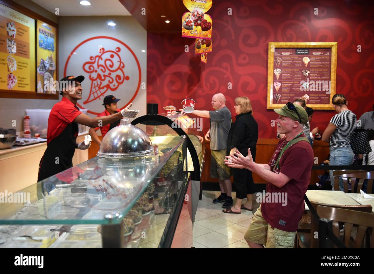 Ice cream vendor throws ice cream cups through the air, Cold Stone ...