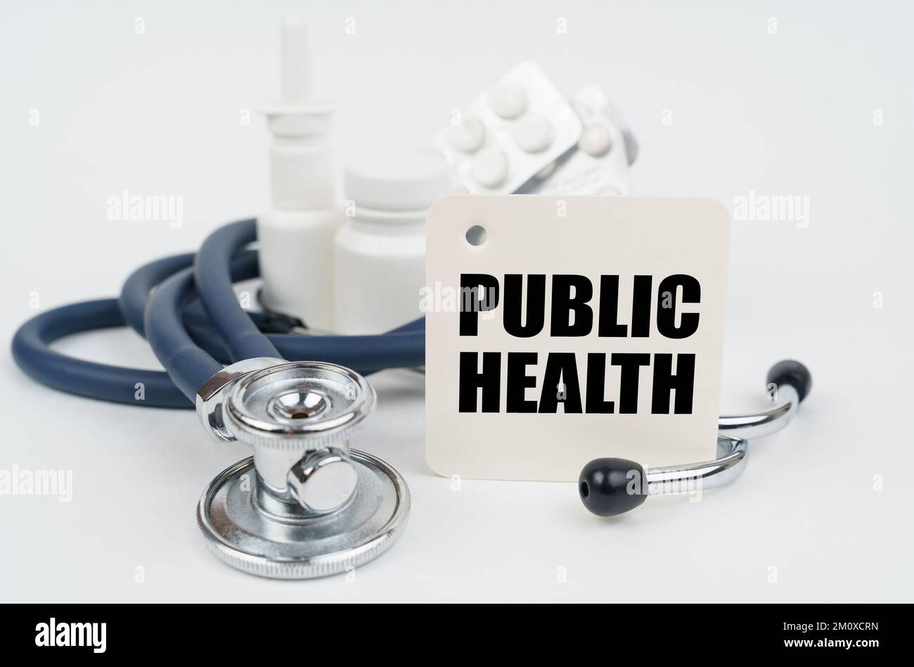 Medical concept. On a white surface, medicines, a stethoscope and ...