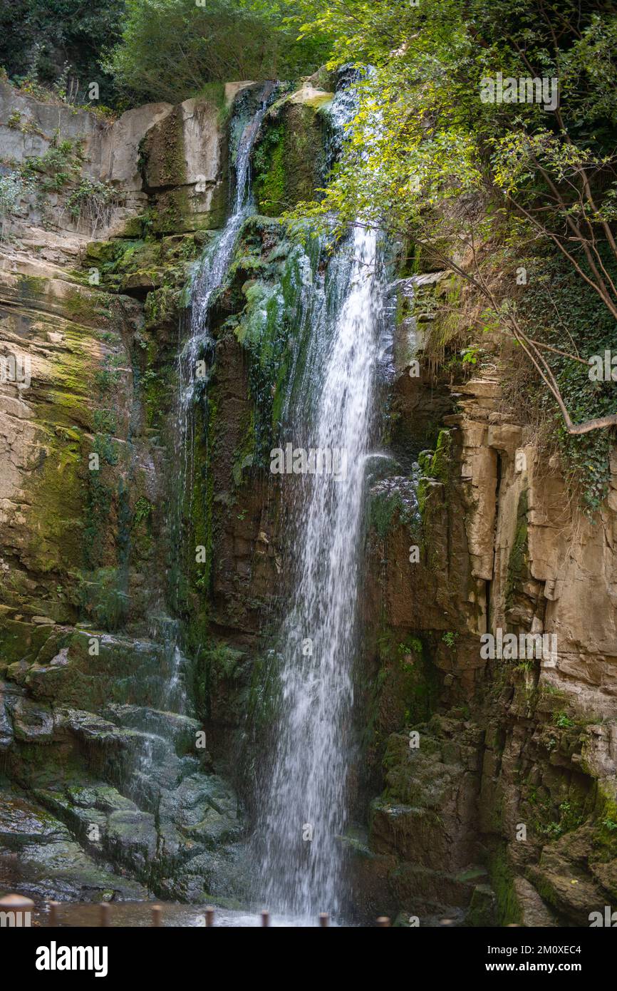 blue waterfall in Tbilisi green trees and bridge Stock Photo - Alamy