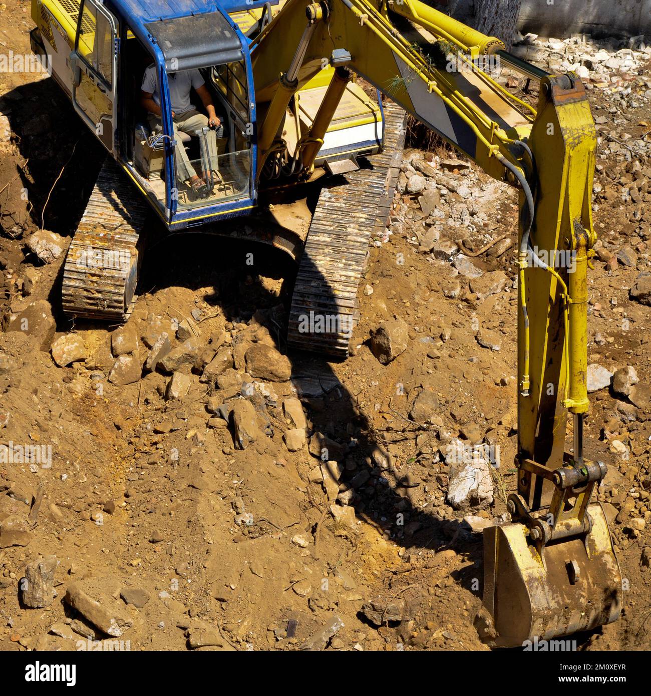Excavator continues to work at the construction site, excavation site and excavator Stock Photo ...