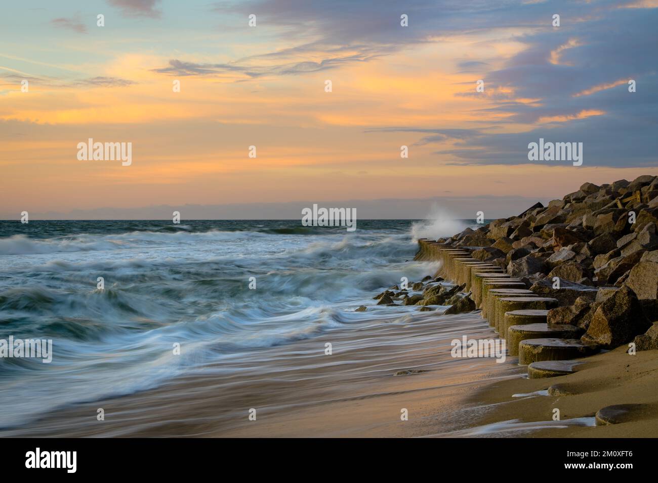 The rocks at Fort Fisher, North Carolina against scenic sunrise Stock ...
