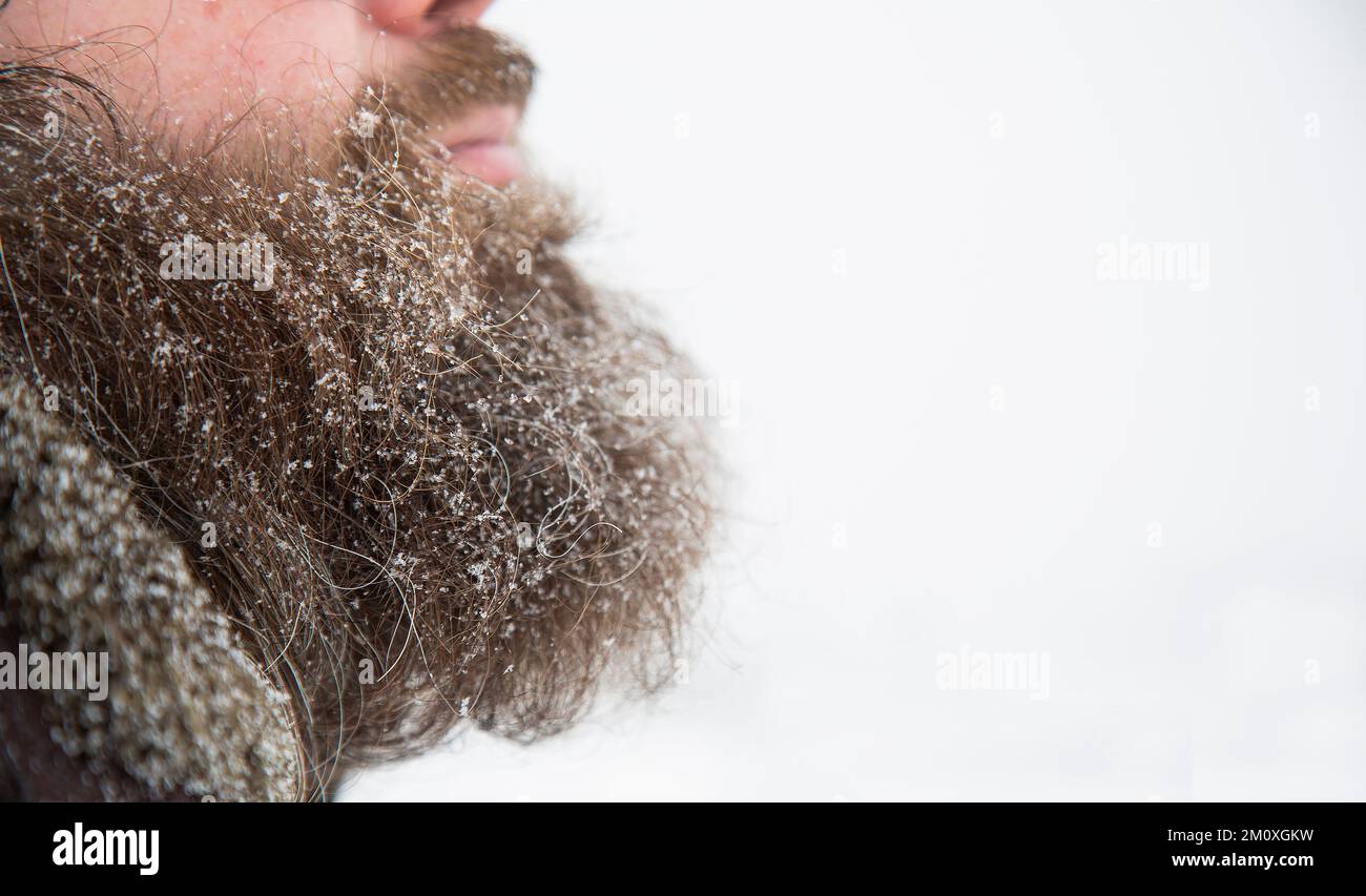 Bearded man in snowy weather on the street in the snow. Snow on the ...