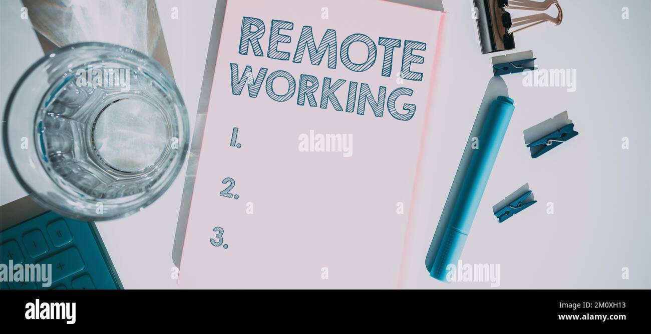 Hand writing sign Remote Working. Business overview situation in which ...