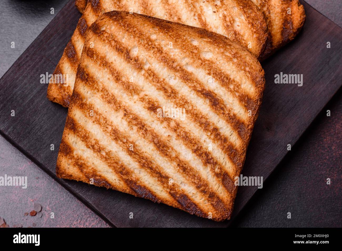 Tasty fresh crispy bread slices in the form of grilled toast for ...