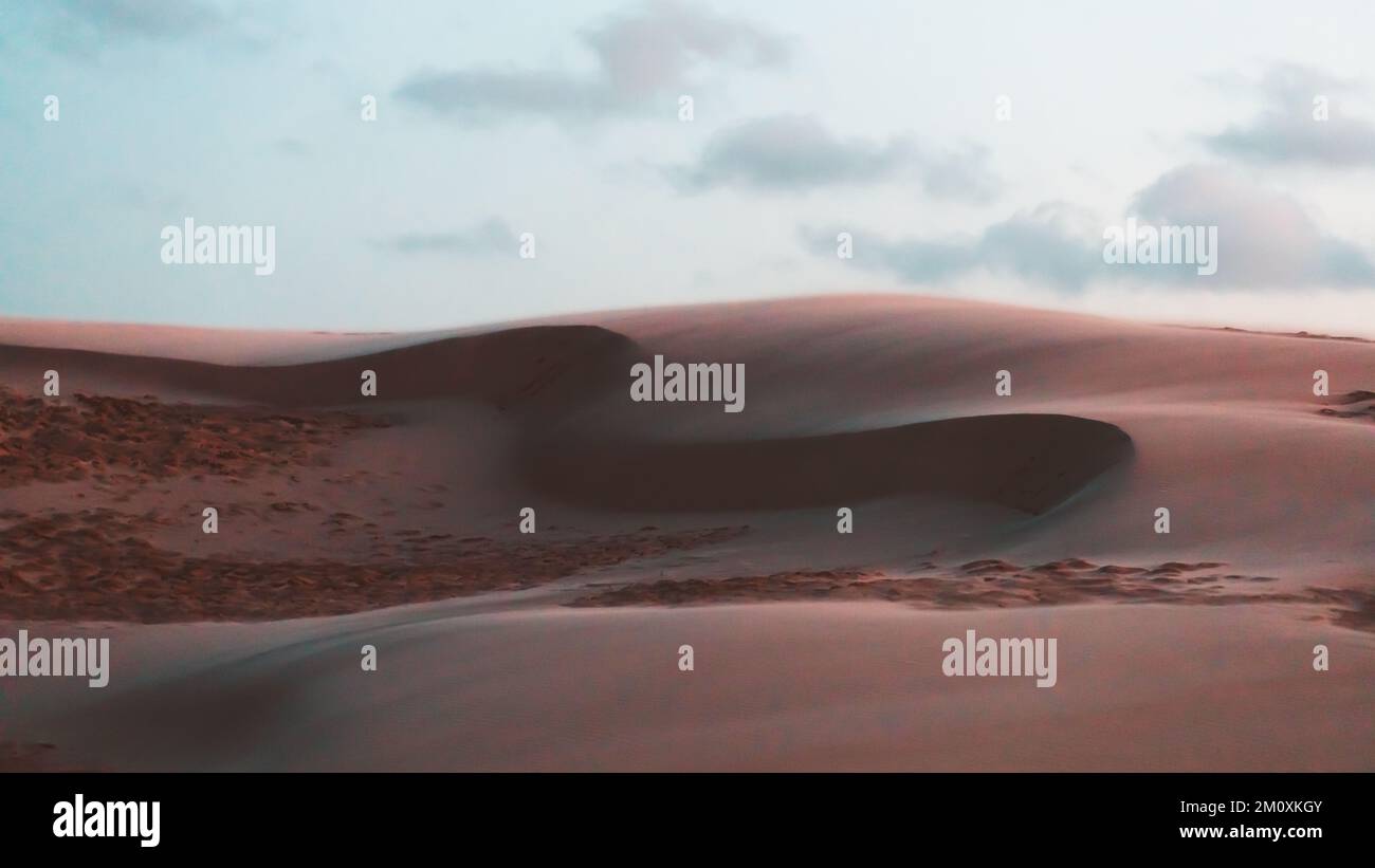 A beautiful scene of Rabjerg Mile coastal dune in Skagen, Denmark with ...