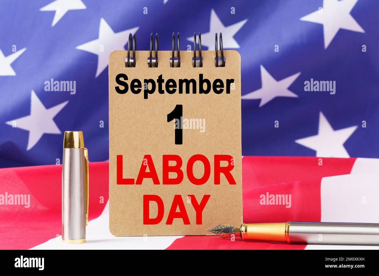 USA Holidays. Against the background of the US flag lies cardboard with ...