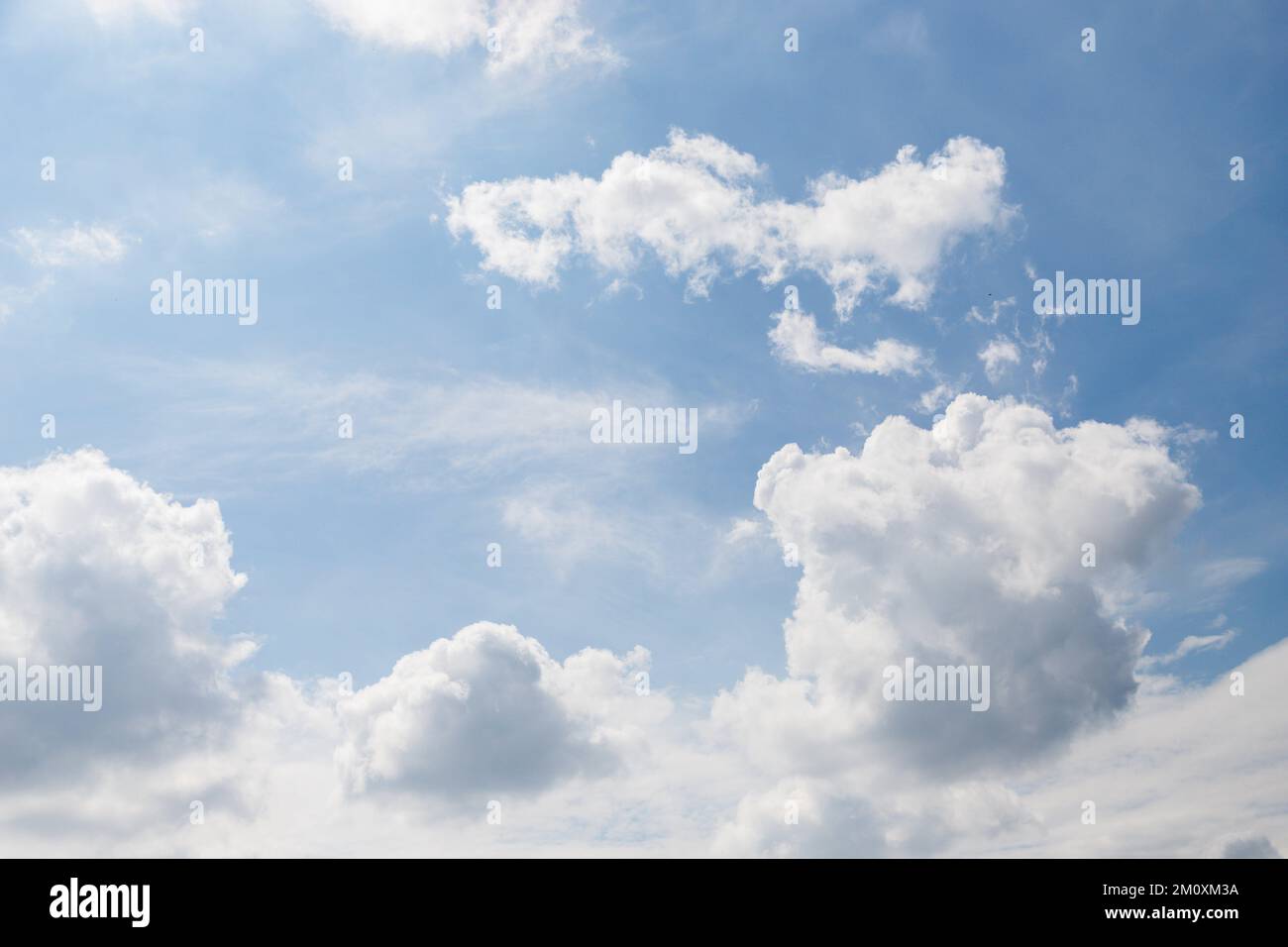 Light blue sky with soft white clouds Stock Photo - Alamy