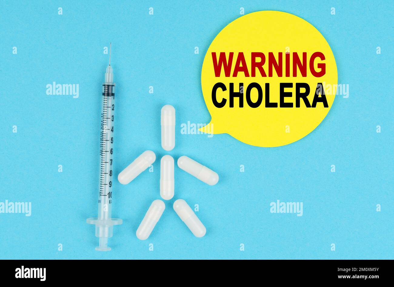 Medicine and health concept. Syringe, human figure made of pills and ...