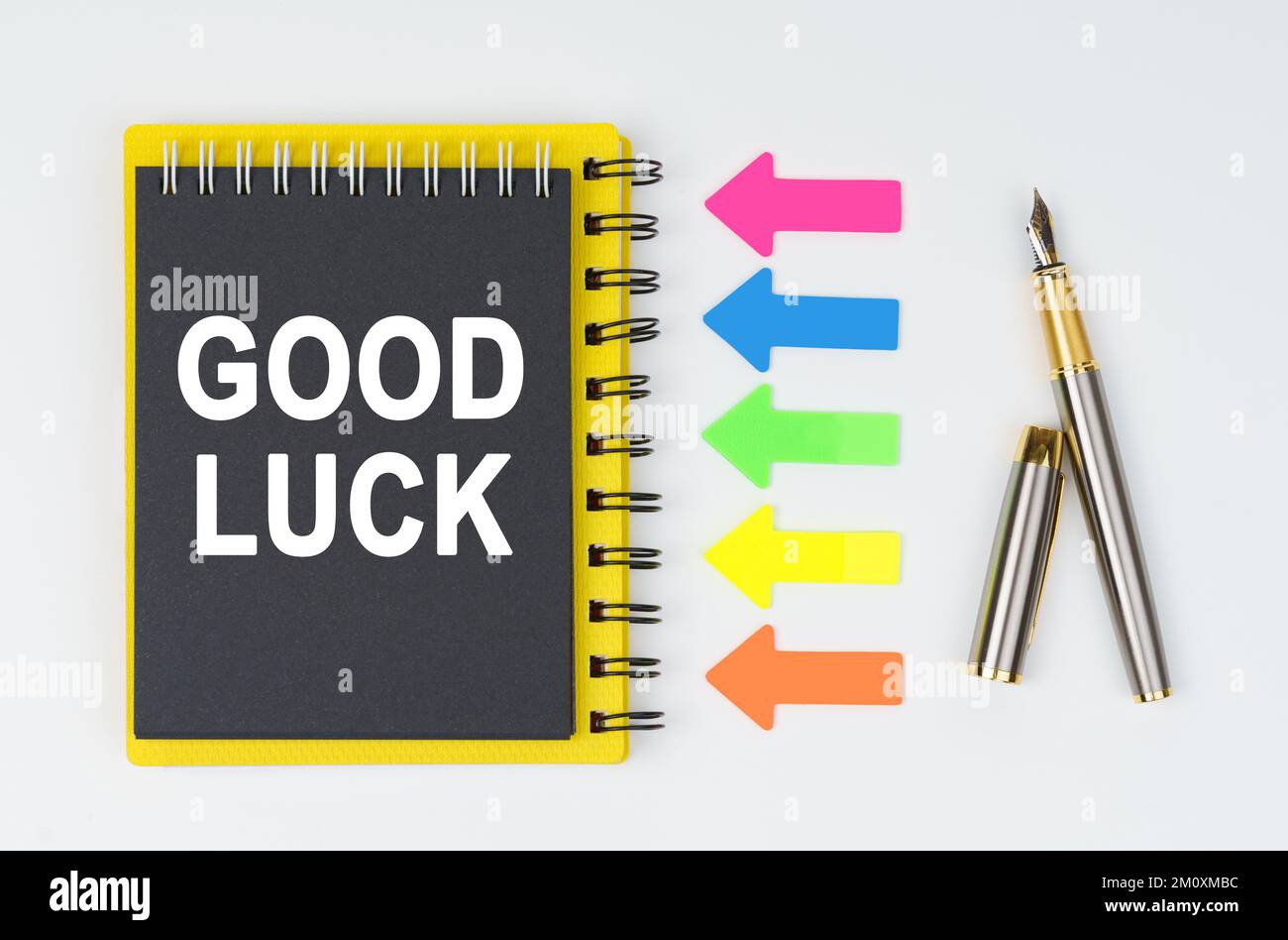 Business and finance concept. On a white background lies a pen, arrows ...