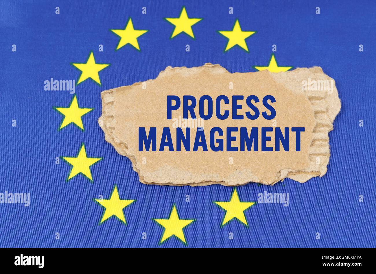 Business and finance concept. There is a cardboard box on the EU flag ...