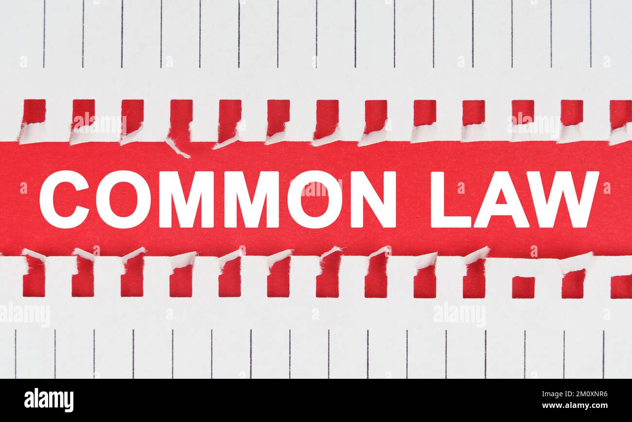 Business and law concept. Between two sheets of notebook on a red ...