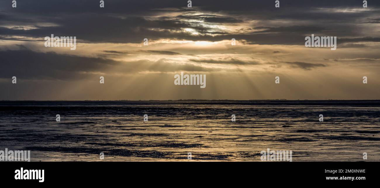 Rays of sun through a gap in the clouds - late afternoon on empty ...