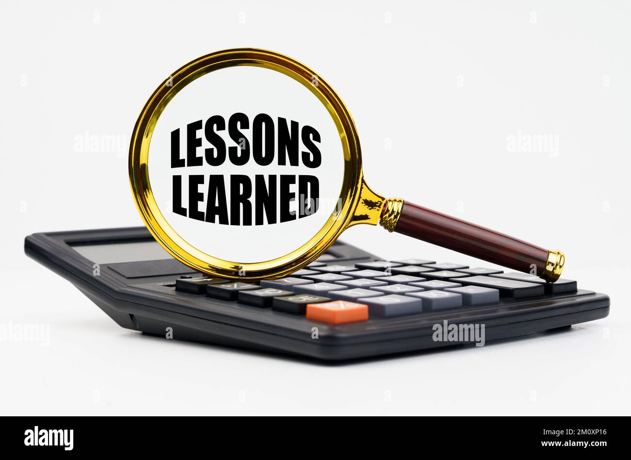 Finance and business concept. On a white background lies a calculator ...