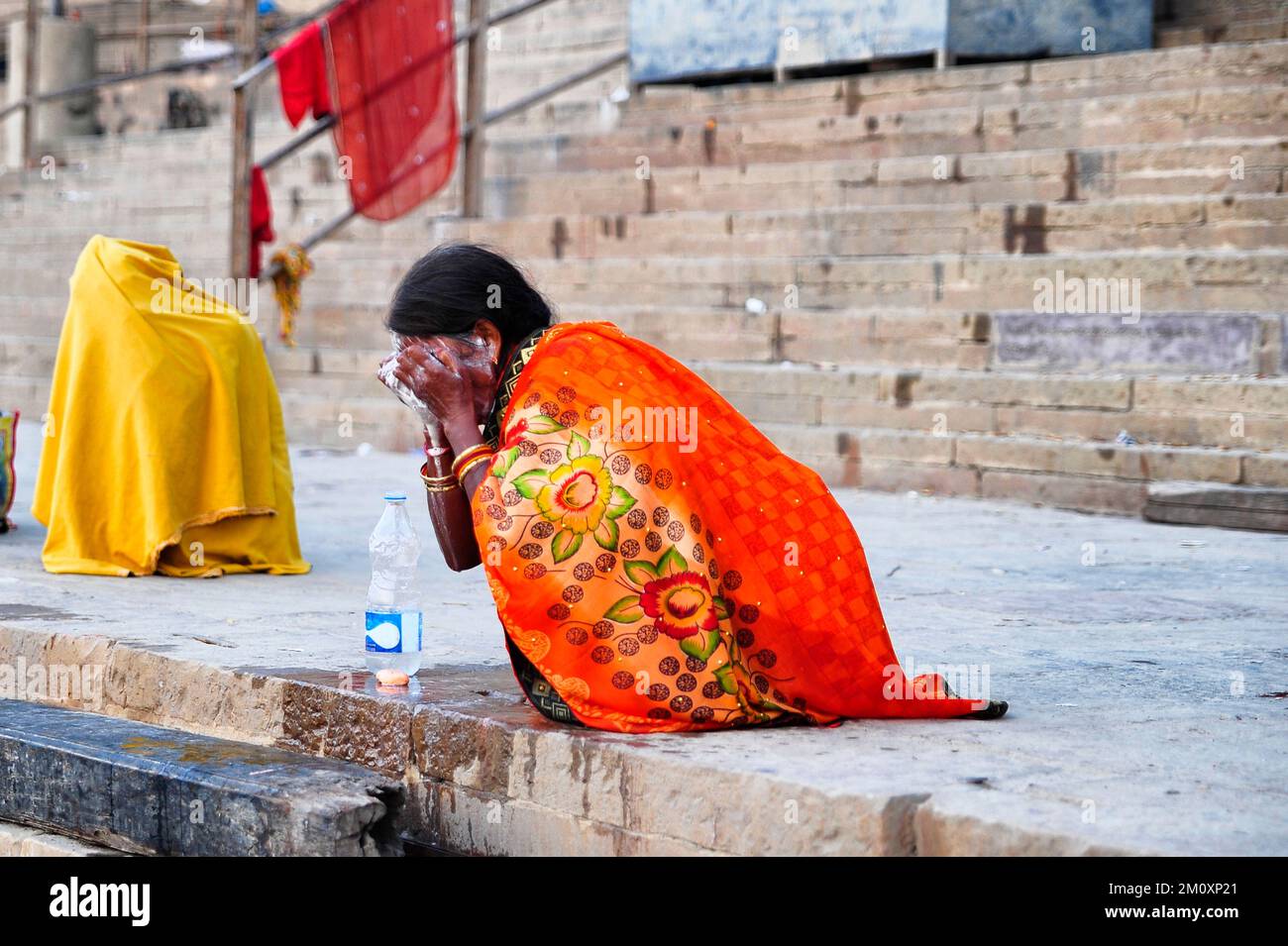 Woman Hindu pilgrim bathing and praying in Ganges river, Varanasi Stock ...