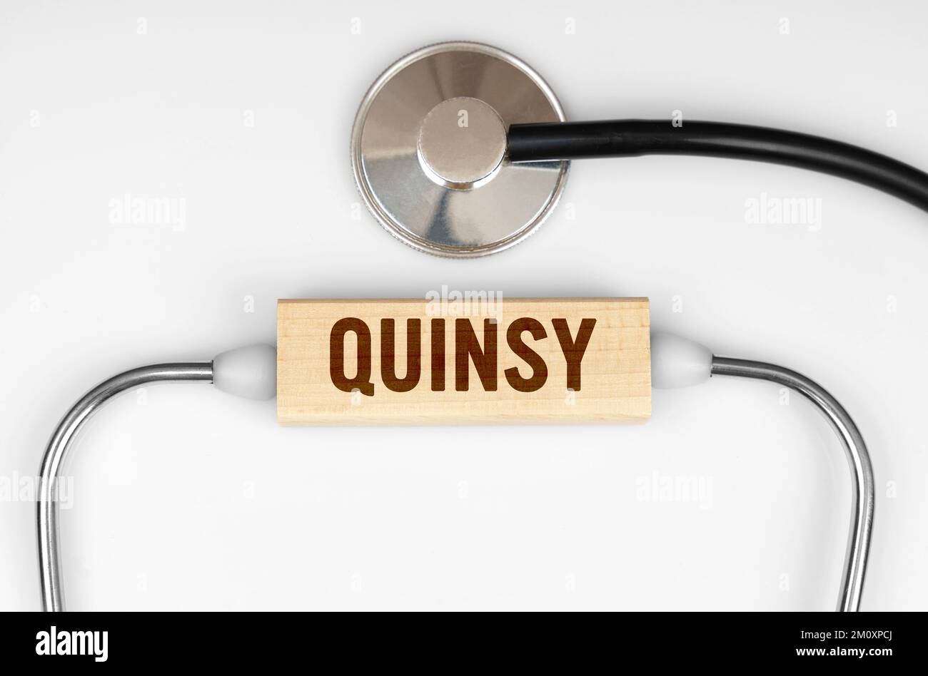 Health and medicine concept. On the table is a stethoscope and a wooden ...