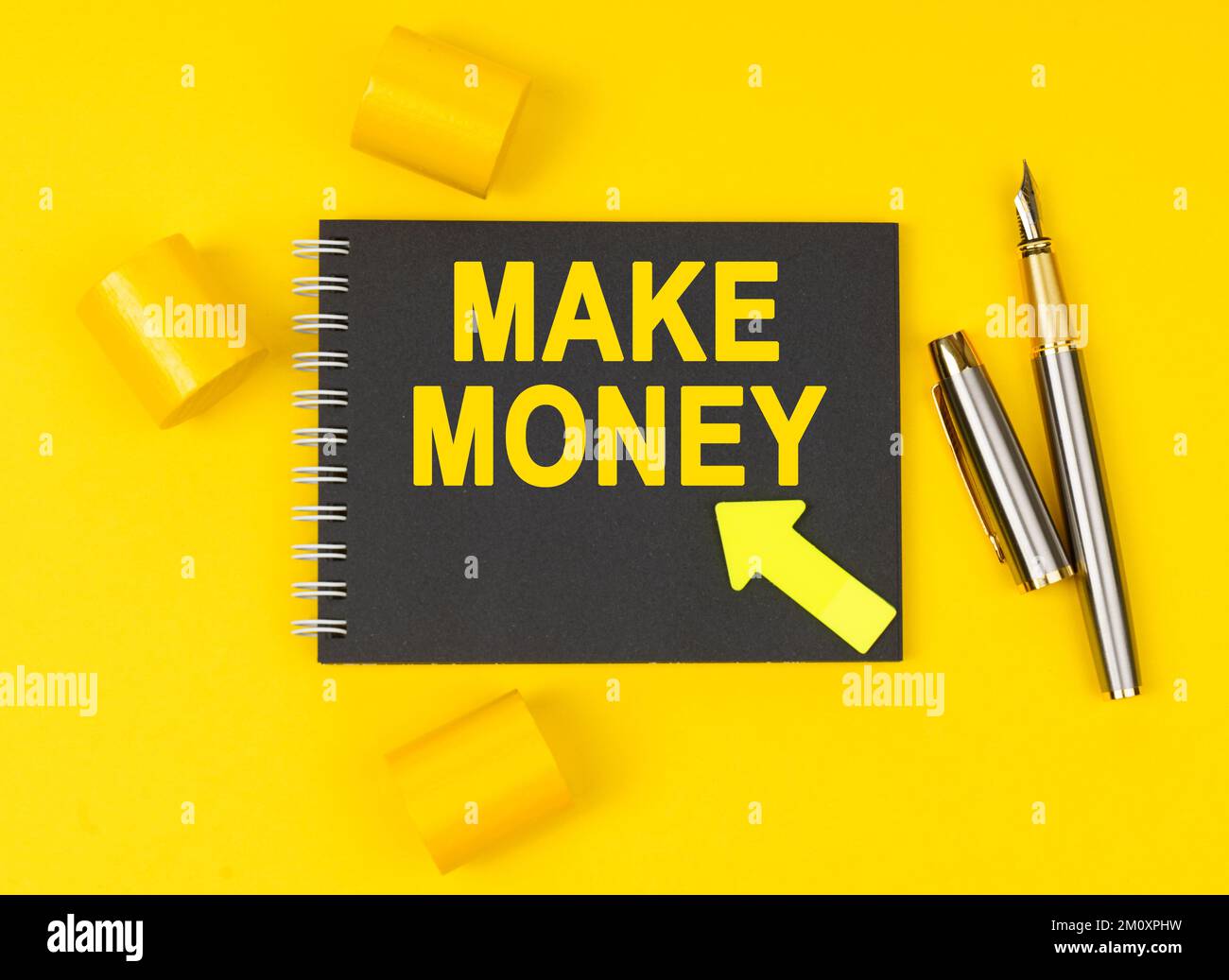 Business and finance concept. On a yellow background lies a pen, a ...