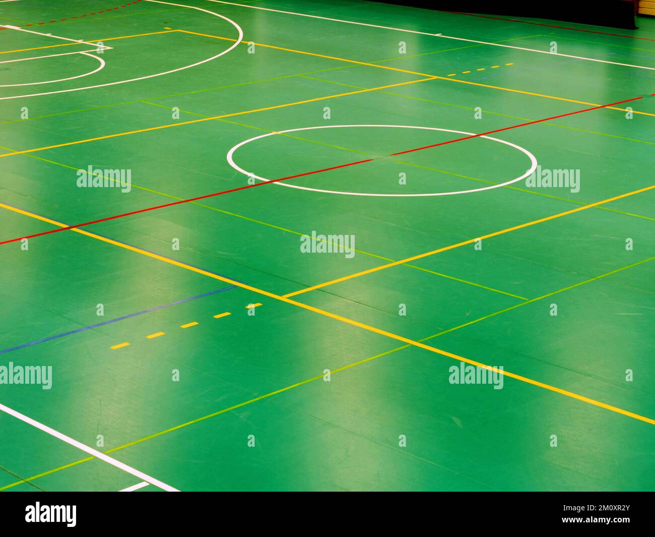 Light reflection in green indoor playfield for basketball or handball ...