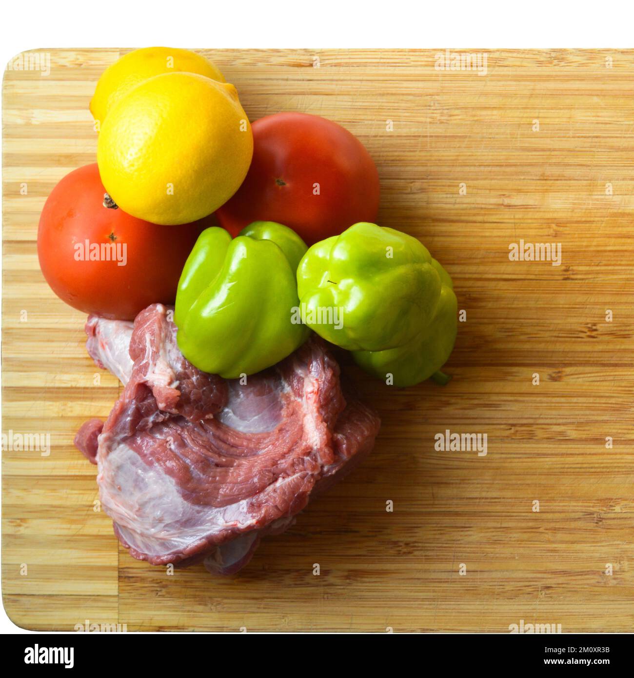 Clean red raw cow meat beef, and very fresh vegetables on bamboo ...