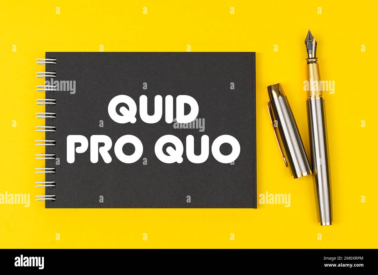 Business and finance concept. On a yellow background lies a pen and a ...