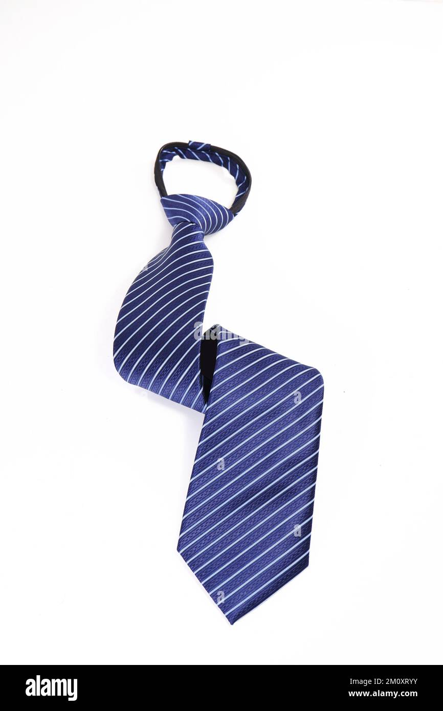 A vertical shot of a blue-striped polyester necktie isolated on a white ...