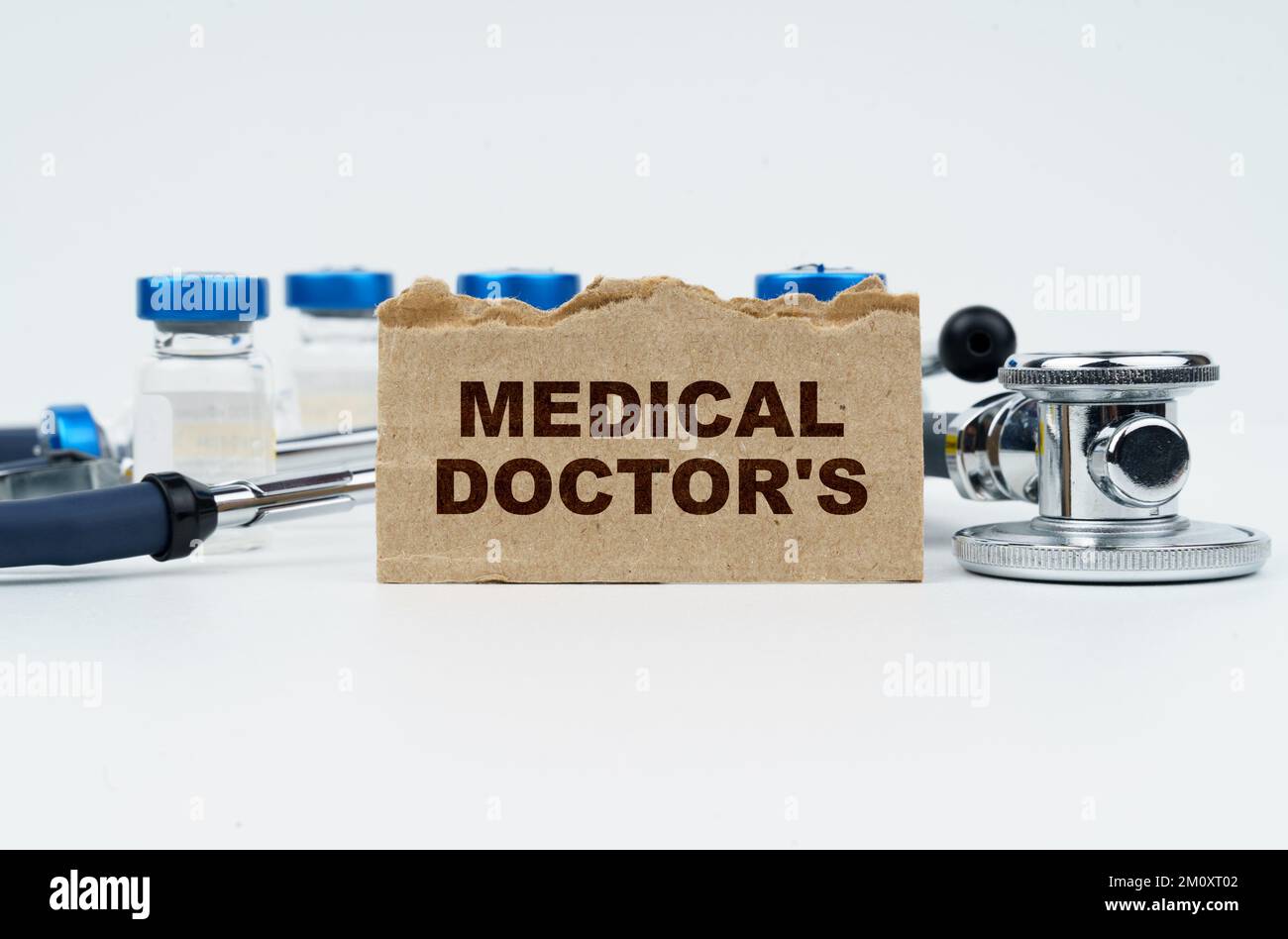 Medicine and health concept. On a white table lie ampoules, a ...