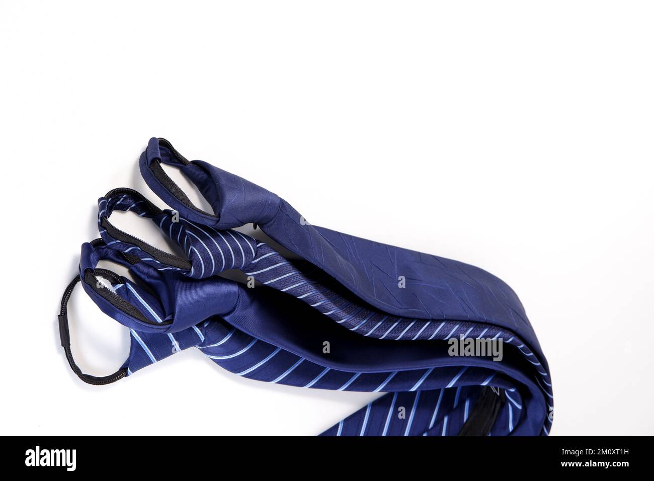 A group of blue polyester neckties isolated on a white background Stock ...