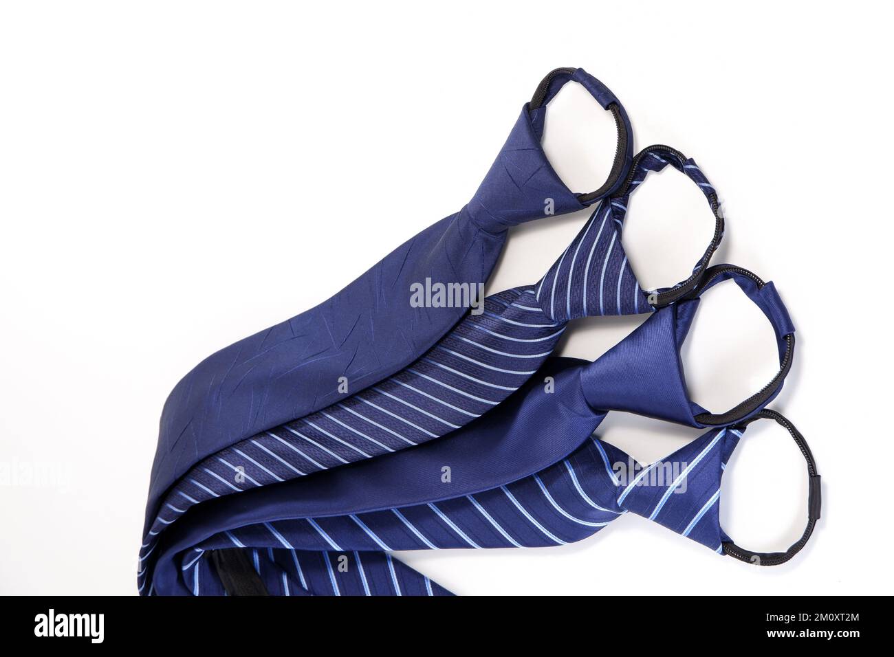 A group of blue polyester neckties isolated on a white background Stock ...