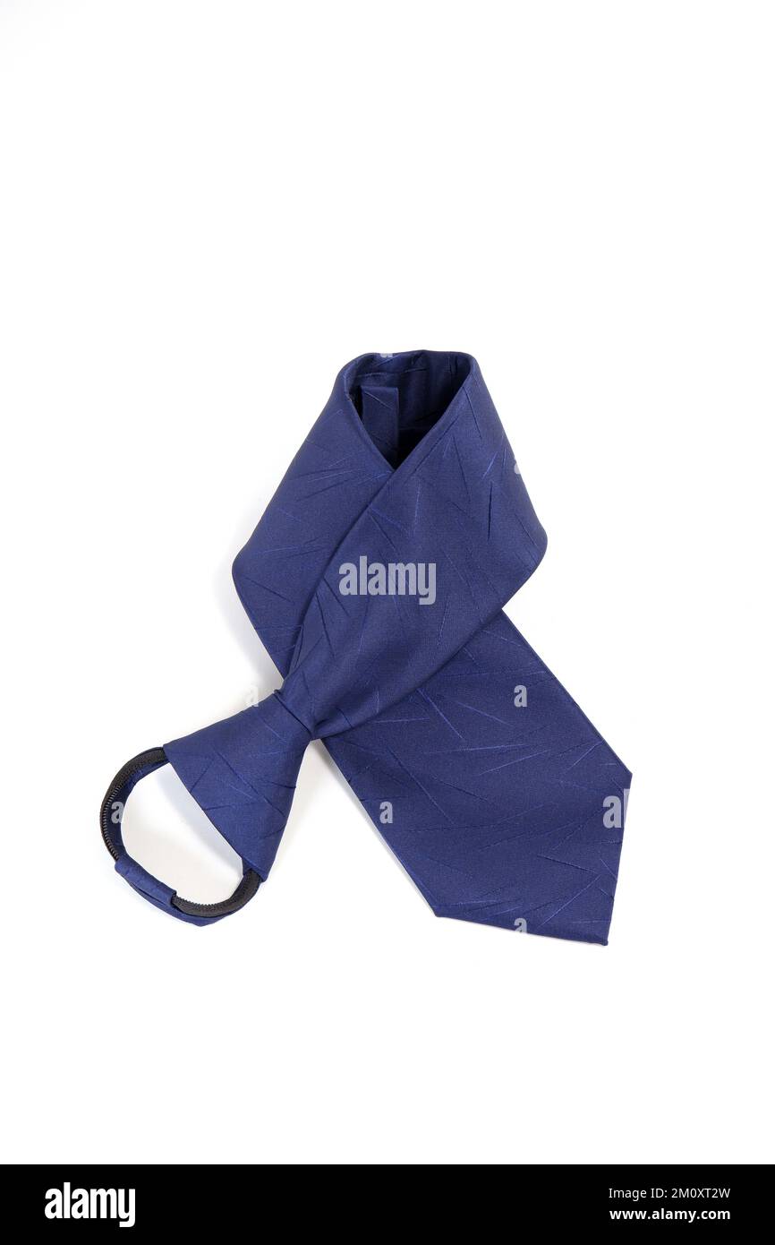 A vertical shot of a blue polyester necktie isolated on a white ...