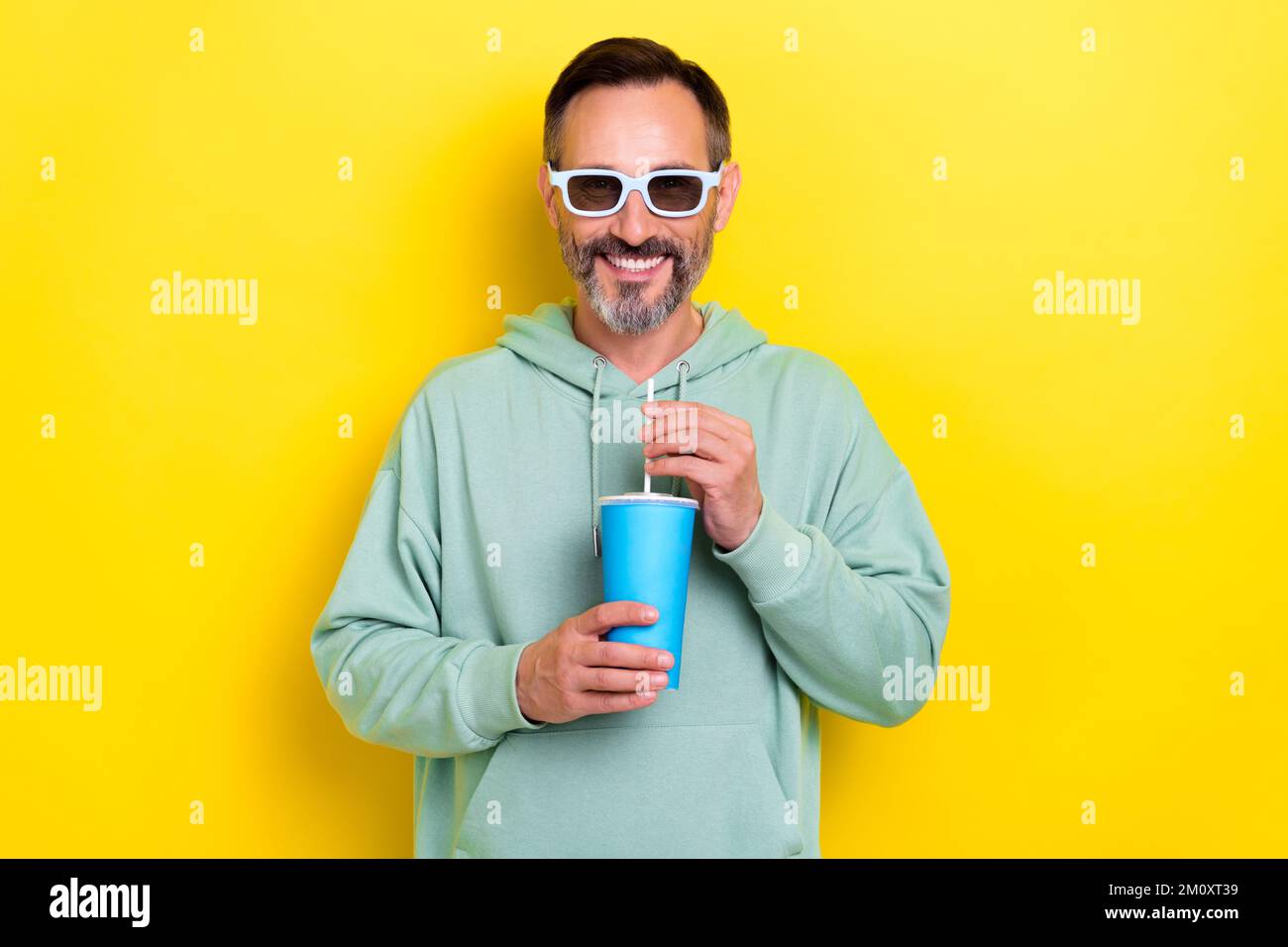 Photo of toothy beaming smiling mature aged man hold soda cup drink ...