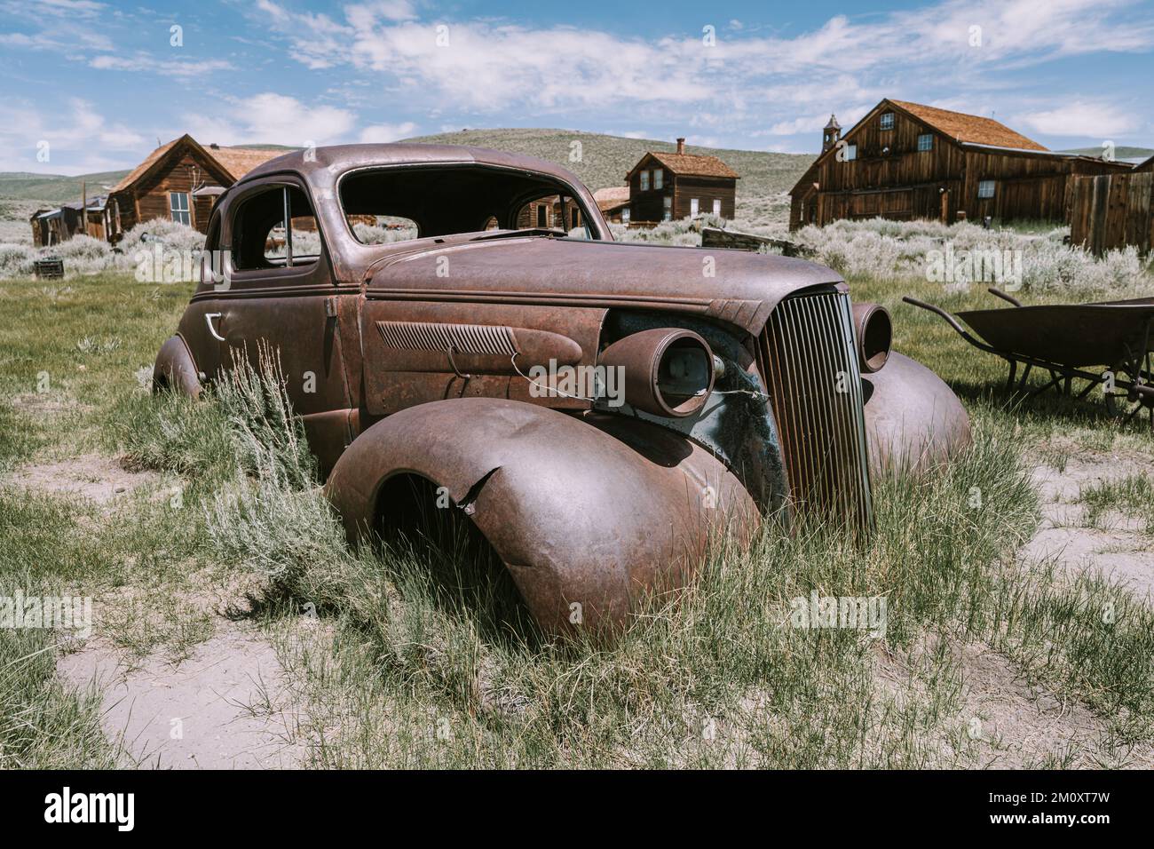 A broken vintage car in a field Stock Photo - Alamy
