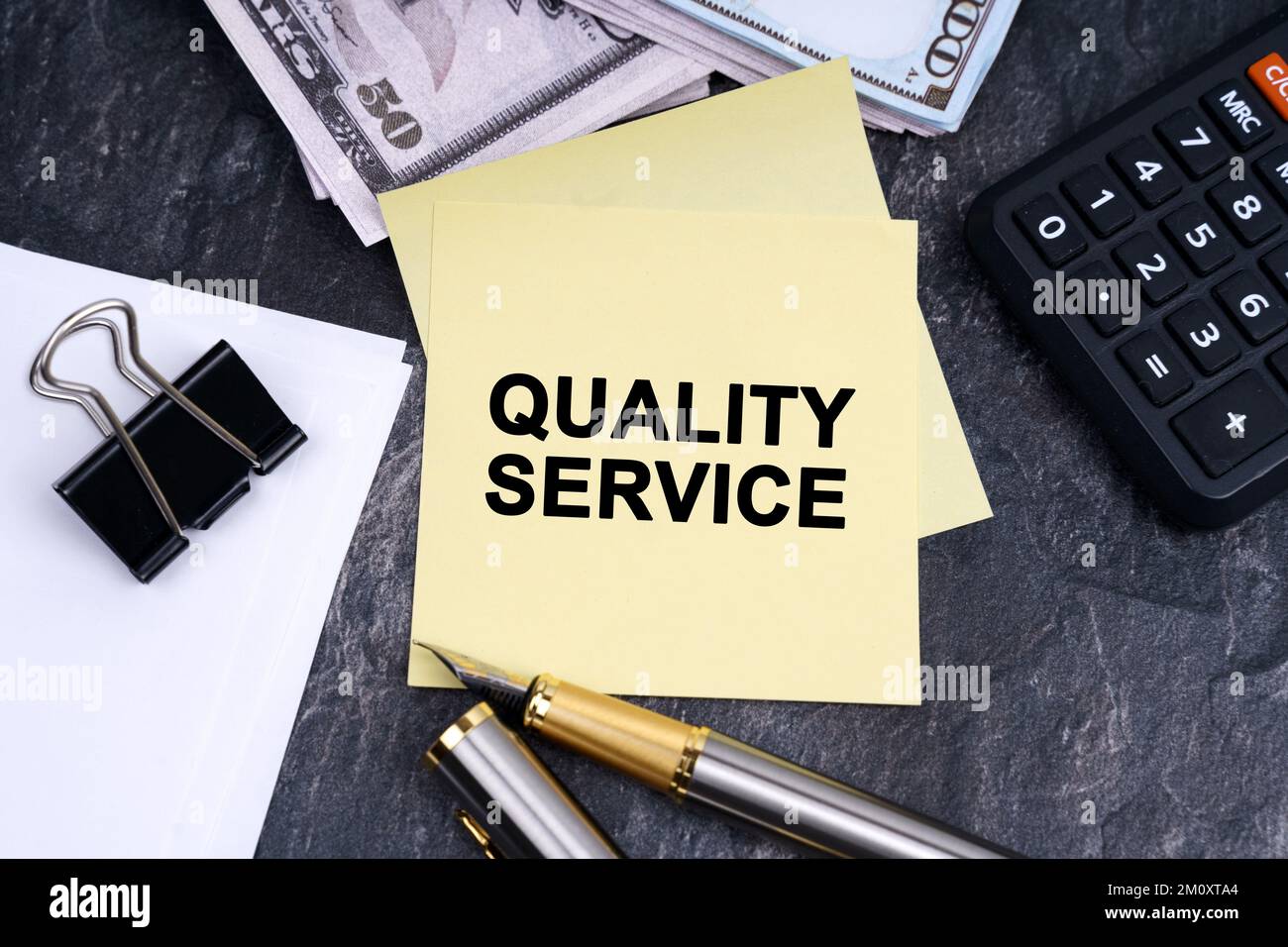 Finance and business concept. On the table is a calculator, a pen ...