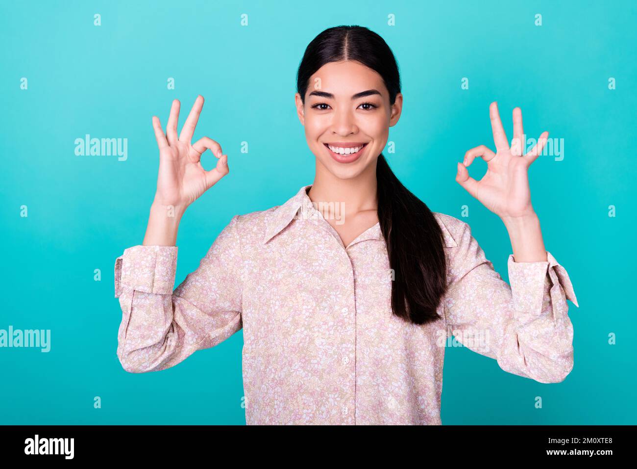 Portrait of satisfied nice vietnamese lady hands fingers demonstrate ...