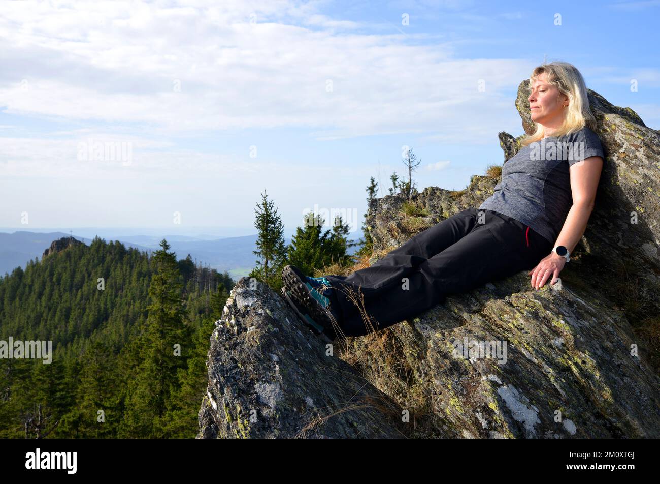Woman on the top of mountain Grosser Osser ( Velky Ostry ) in the ...