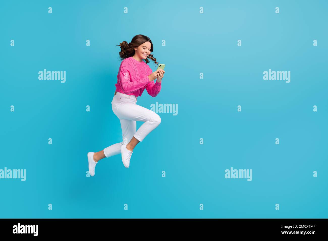 Full length photo of pretty adorable girl dressed knit pullover jumping ...