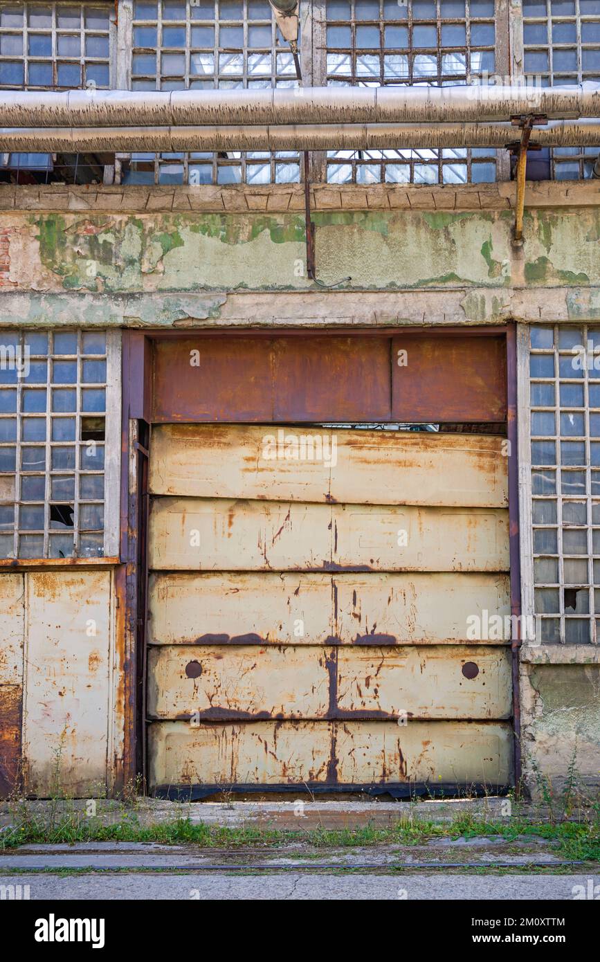 Closed Large Door at Old Factory Industrial Building Stock Photo - Alamy