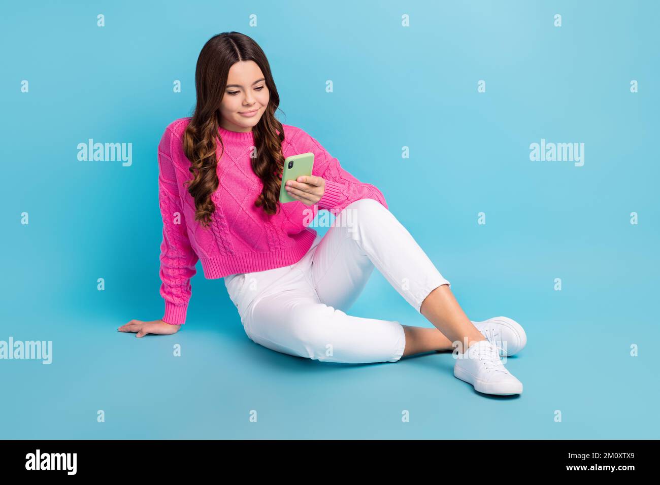 Full length photo of adorable cute girl dressed knit pullover chatting ...