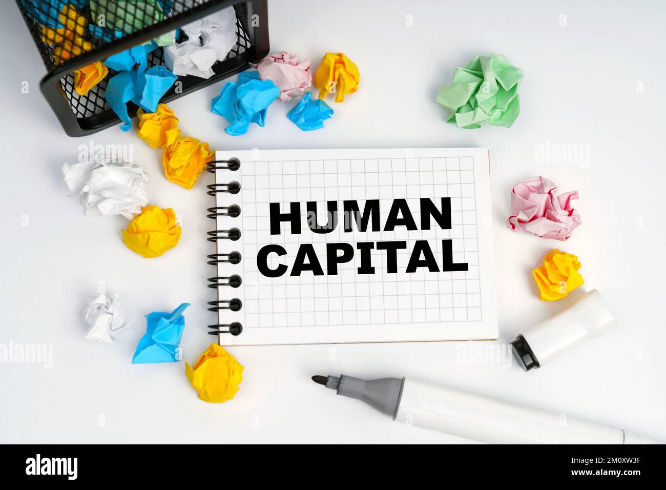 Business and finance concept. On the table is a basket, multi-colored ...