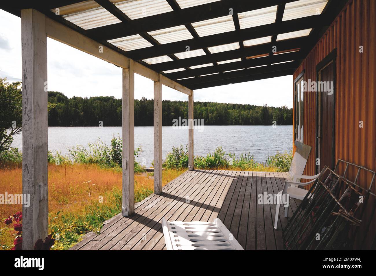 close-up of porch of abandoned house near lake Stock Photo - Alamy