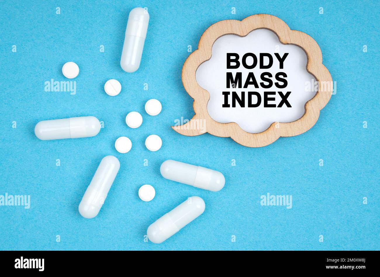 Medicine and health concept. On a blue background, pills and a plate ...