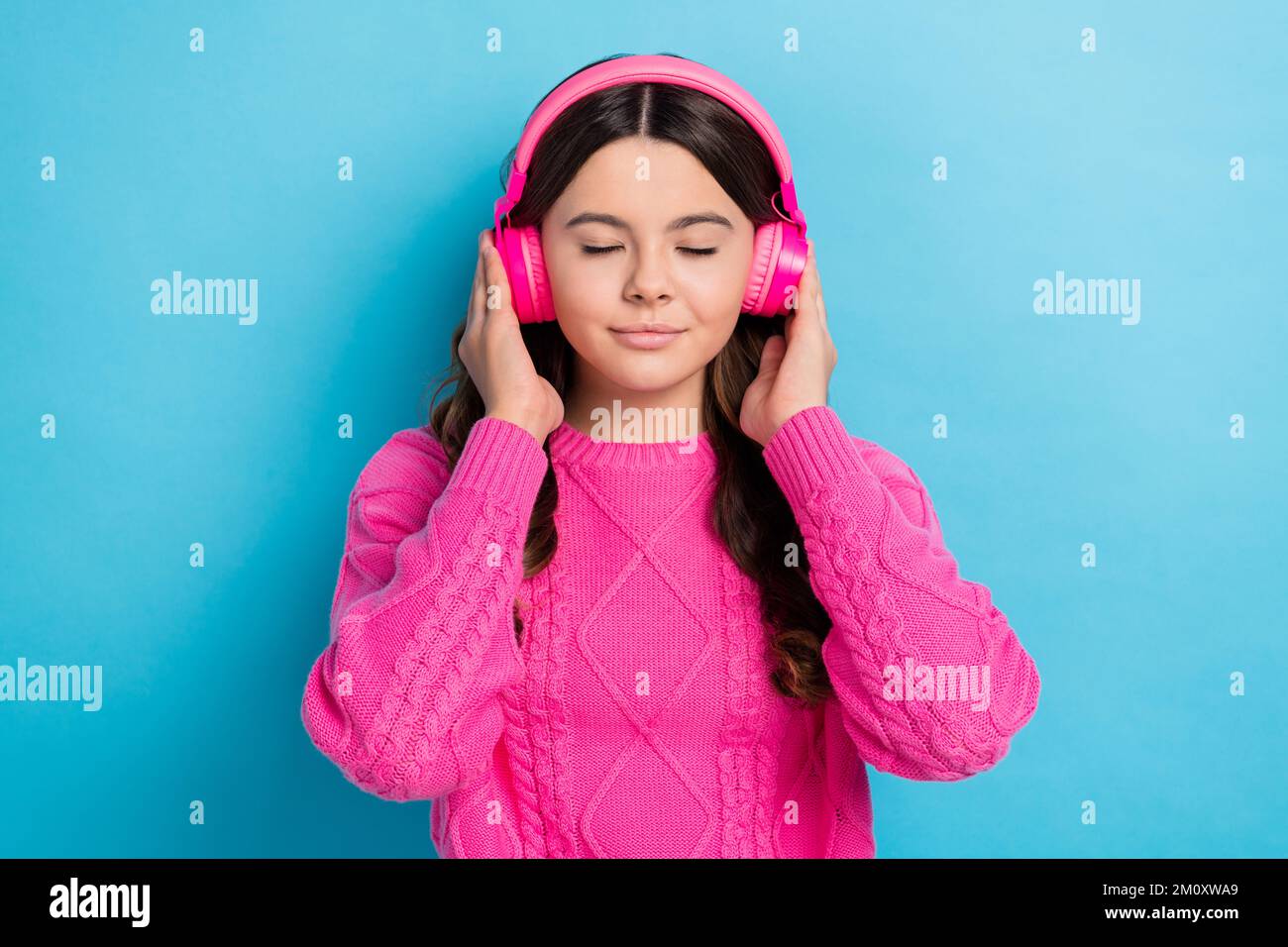 Photo of satisfied teen brown curly hair schoolgirl wear her new pink ...